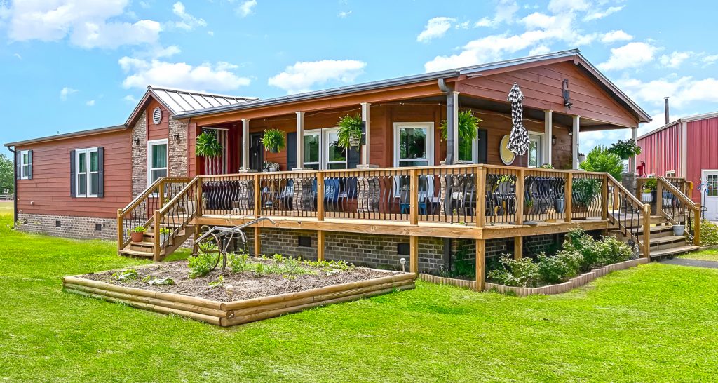 Stunning Cabin Style Mobile Home With Wrap Around Porch And Deck