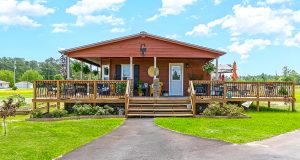 Stunning Cabin Style Mobile Home With Wrap Around Porch And Deck
