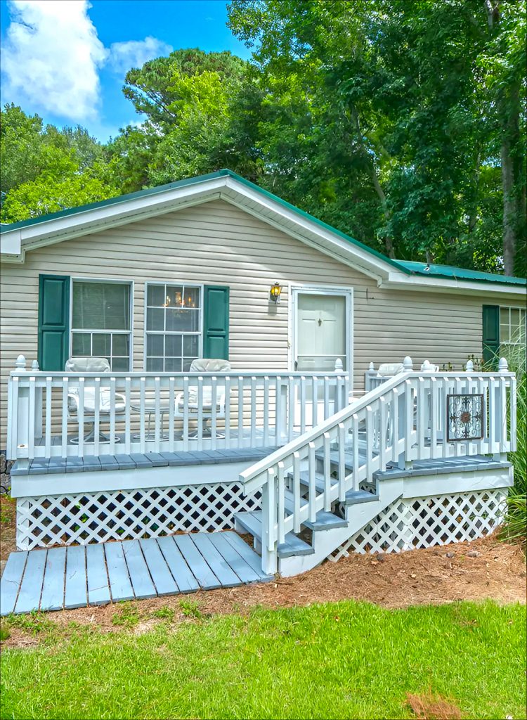 Mobile Home Makeover with A Large Screen Porch and Front Deck