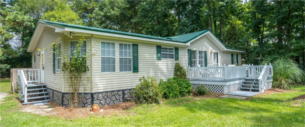 Mobile Home Makeover with A Large Screen Porch and Front Deck