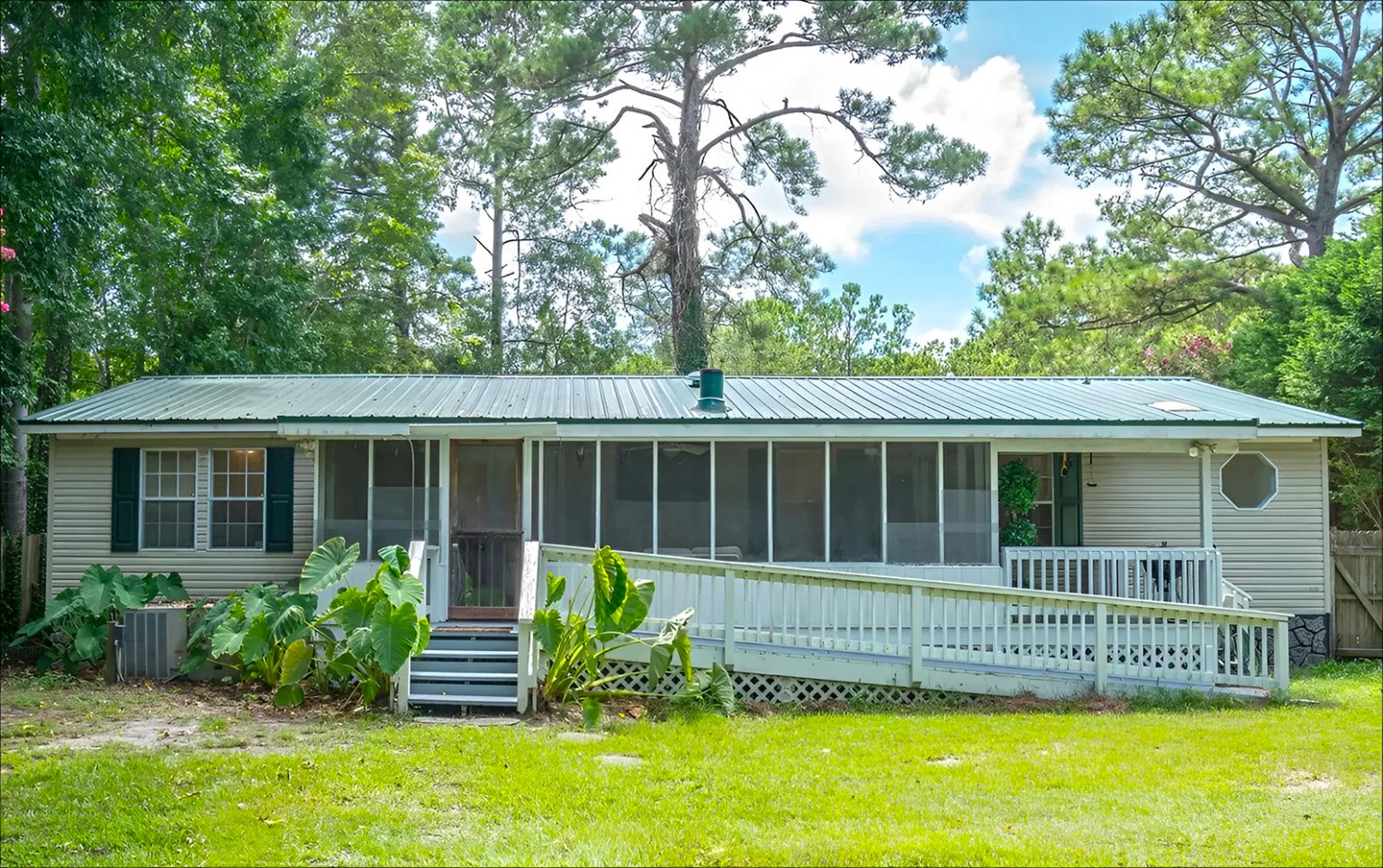 Mobile Home Makeover with A Large Screen Porch and Front Deck